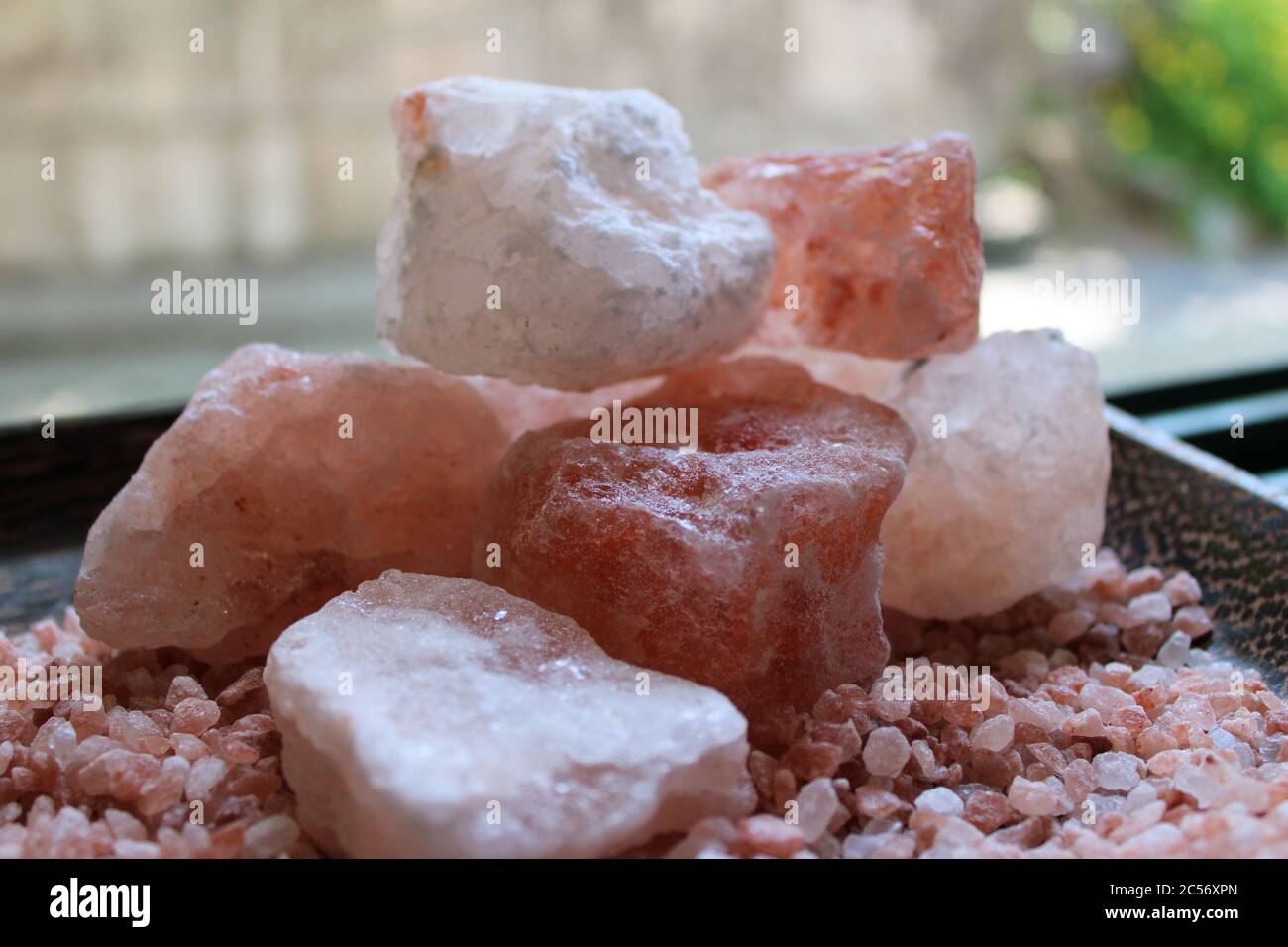 Pink Himalayan salt in rock crystal and granule form Stock Photo - Alamy