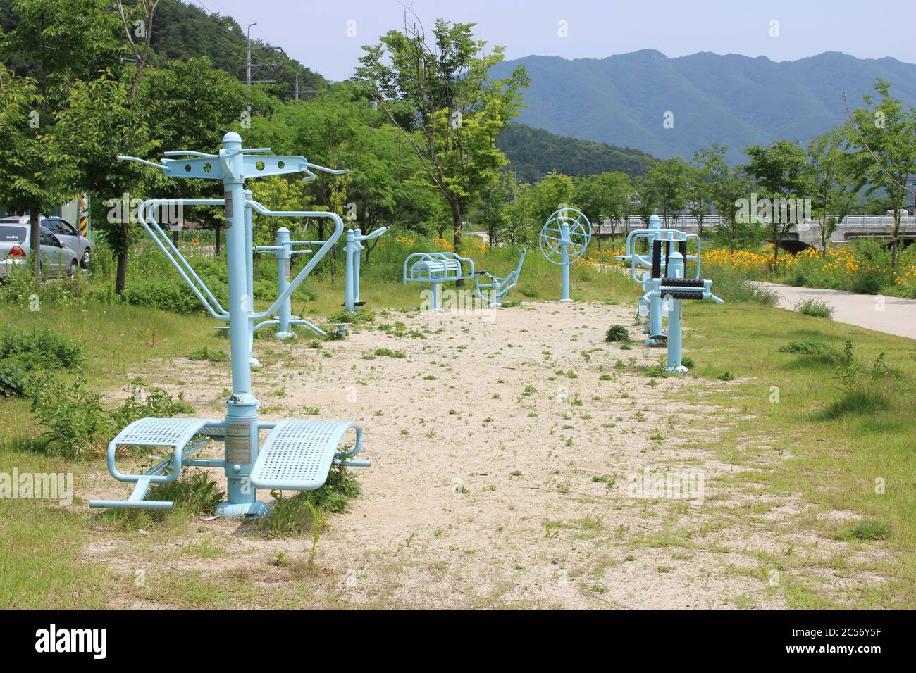 Outdoor public gym equipment in monochromatic blue Stock Photo - Alamy