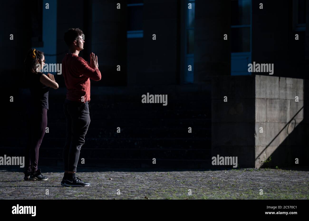 Stuttgart, Germany. 01st July, 2020. Eric and Sheela do the yoga ...