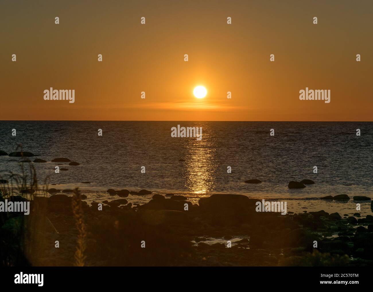 beautiful sunset landscape from a traditional rocky beach on the island ...