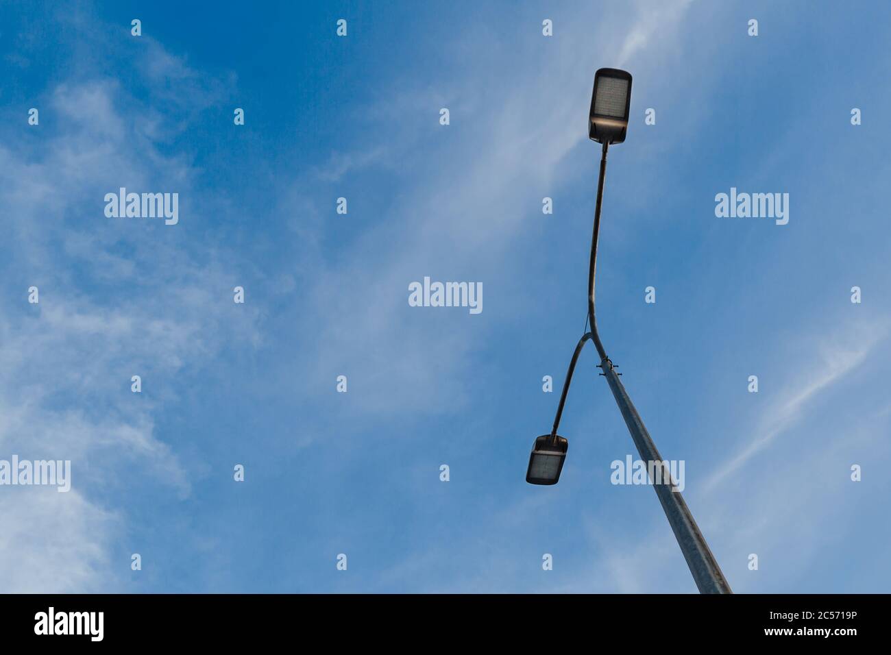 Street lantern on sky background.A modern street LED lighting pole ...