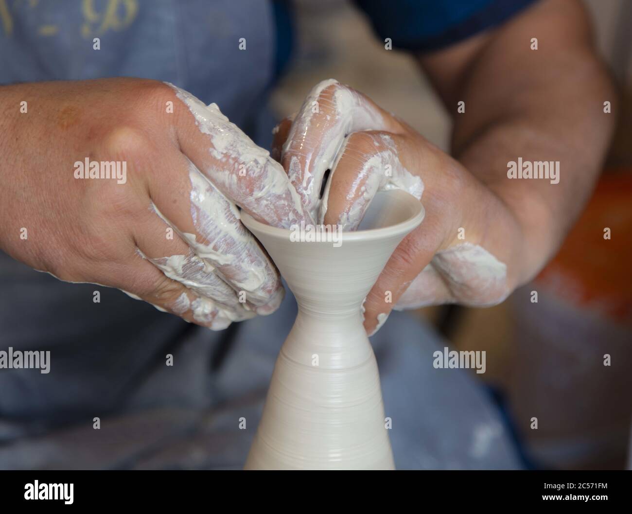 Old hands making pottery hi-res stock photography and images - Alamy