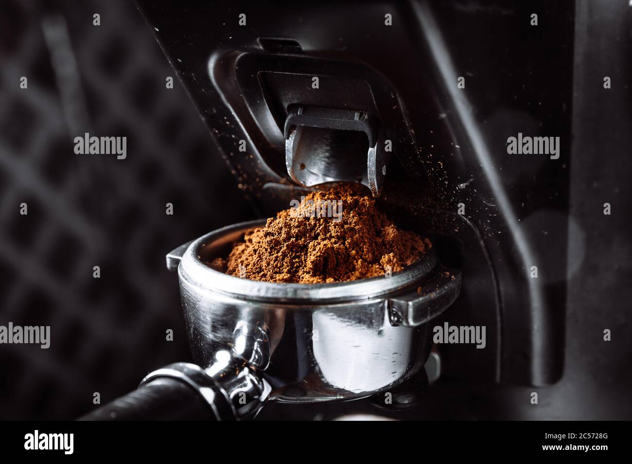 Ground roasted coffee in the filter holder for brewing in a coffee ...