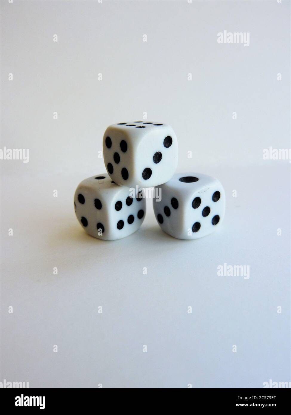 Vertical shot of a stack of dice isolated on a white background Stock ...