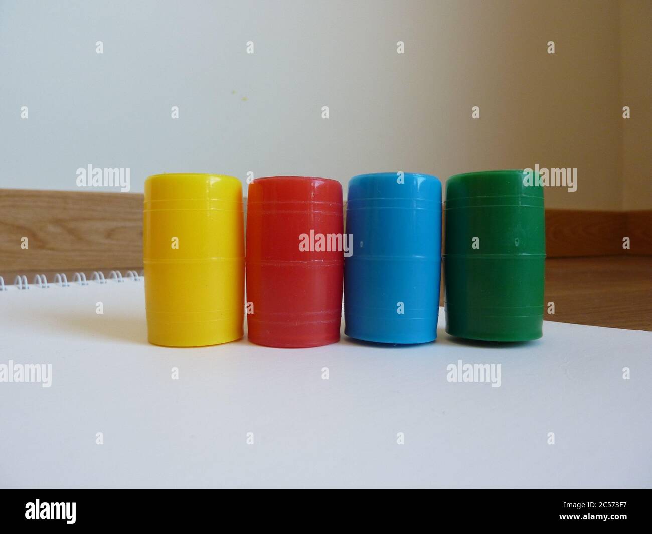 Colorful dice cups for board games Stock Photo - Alamy