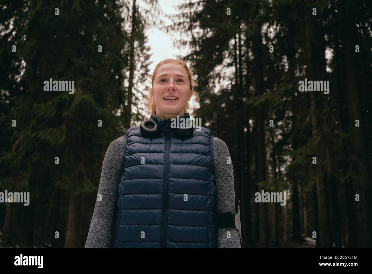 Portrait confident, smiling female runner in woods Stock Photo - Alamy Portrait confident, smiling female runner in woods Stock Photo - Alamy