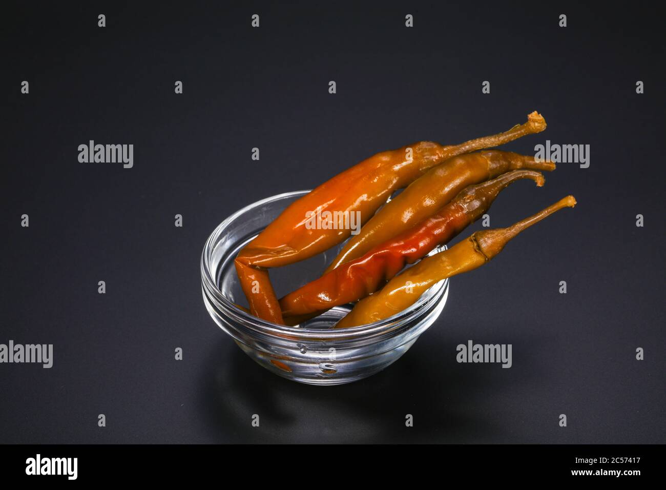 Marinated chilli pepper heap in the bowl Stock Photo - Alamy