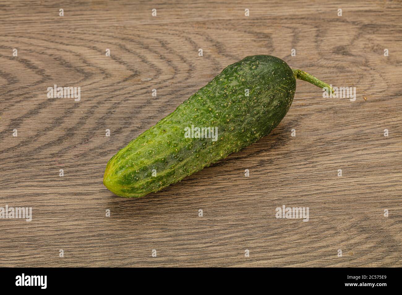 Green ripe fresh one cucumber over background Stock Photo - Alamy