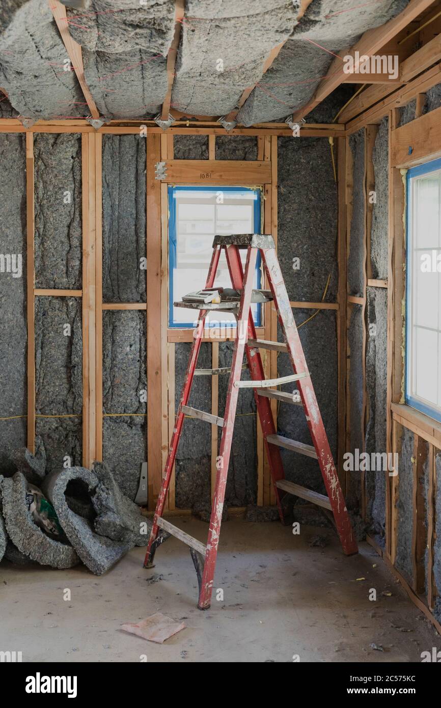 Ladder and insulation in house under construction Stock Photo - Alamy