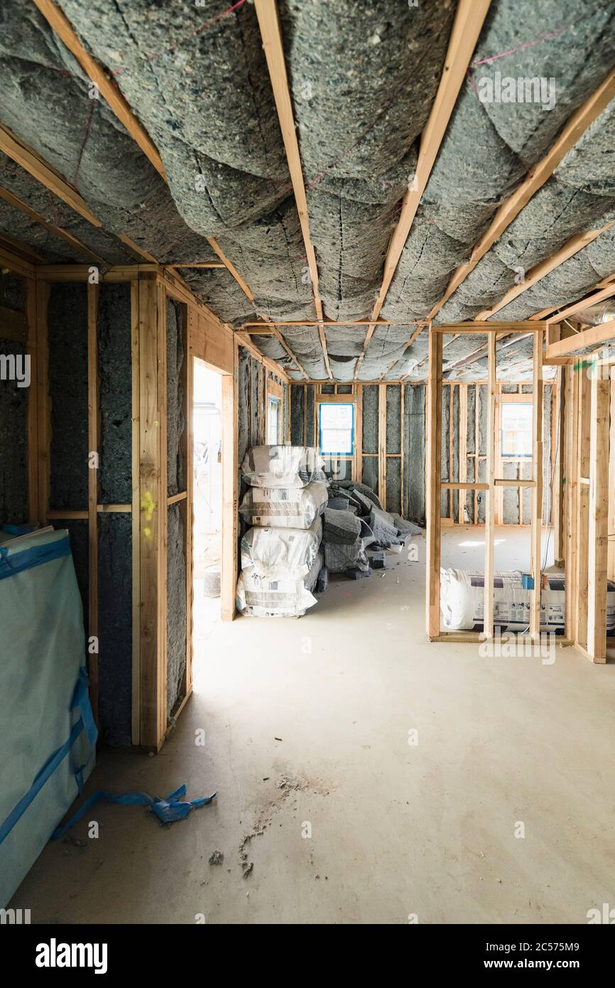 Insulation being installed in house under construction Stock Photo - Alamy