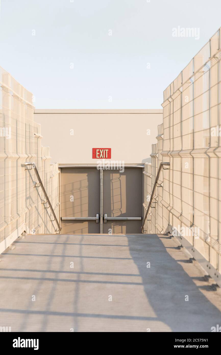 Exit sign above double doors on rooftop Stock Photo - Alamy