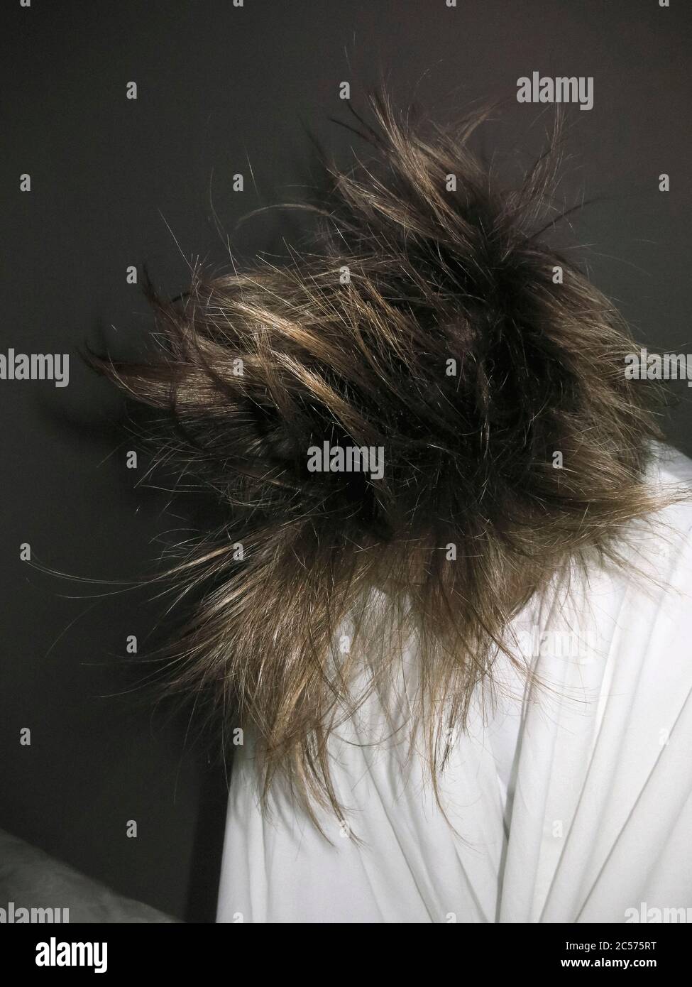 Woman flipping hair Stock Photo - Alamy