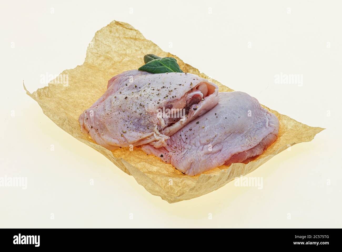 Raw chicken hip with spices isolated on white background Stock Photo ...