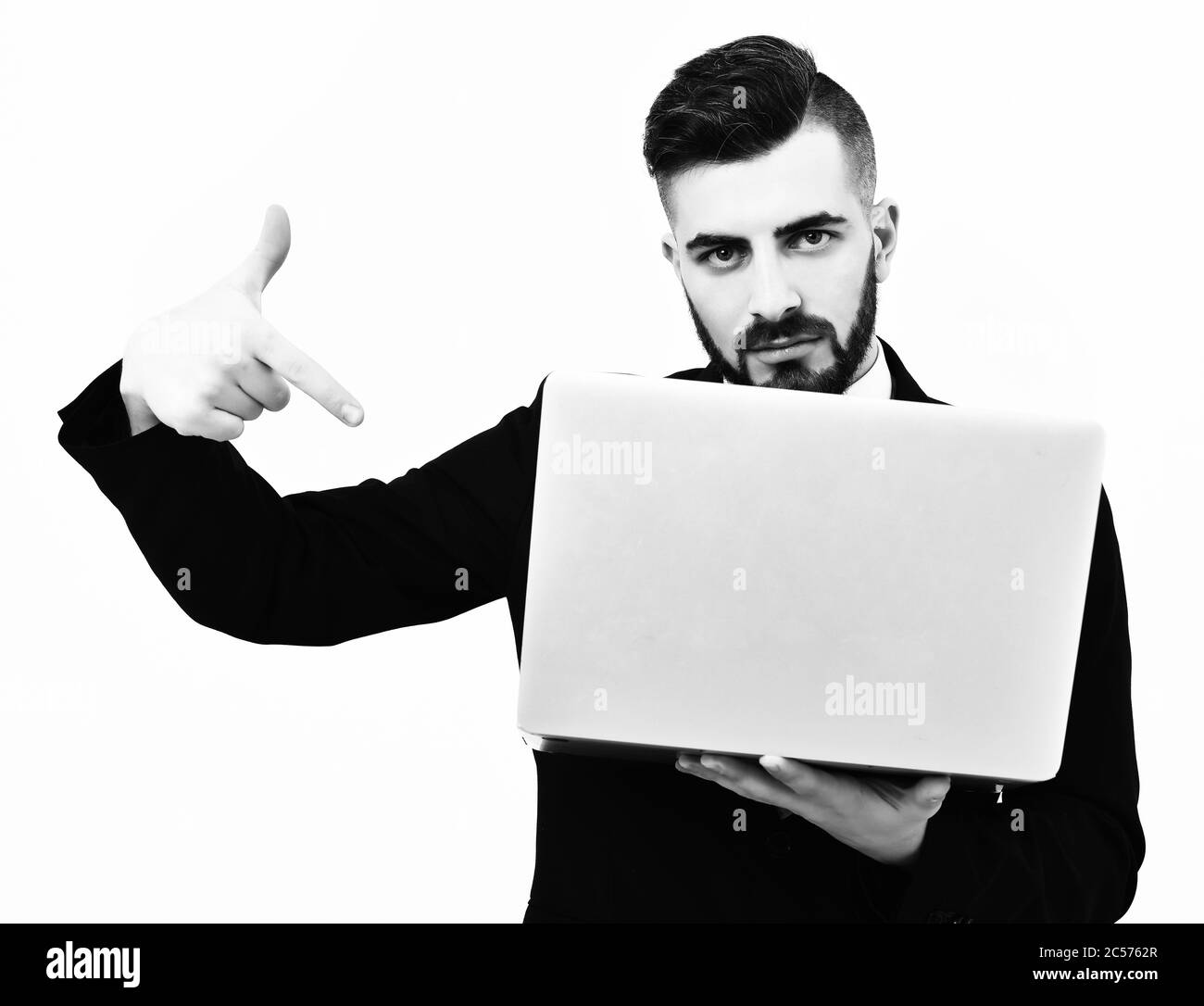 Strict and concentrated CEO with beard in black suit pointing at open ...