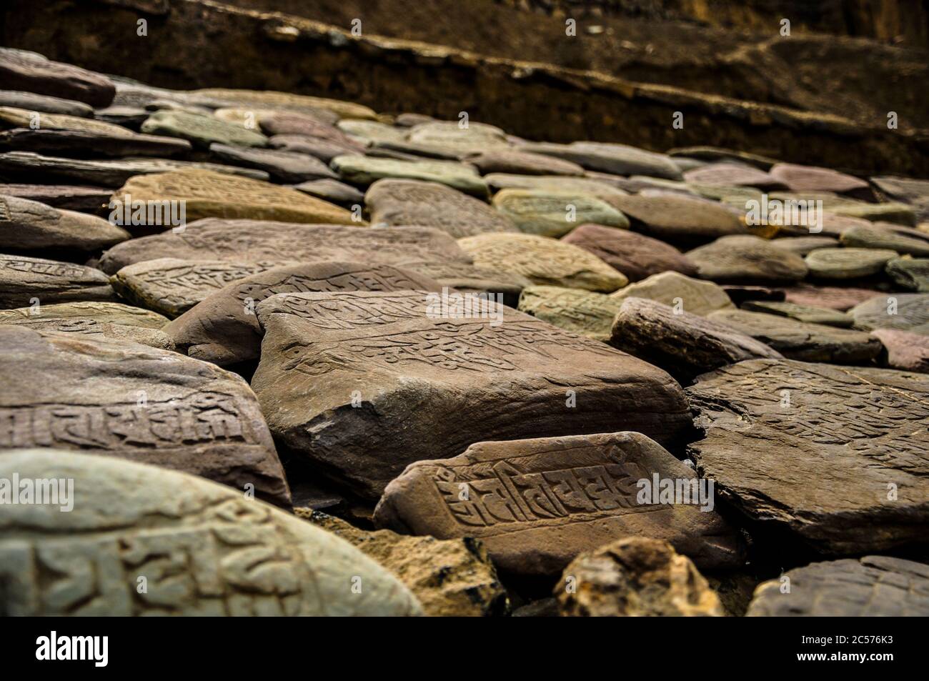 mantra stones in a Ladakh (India) Buddhist monastery Stock Photo - Alamy