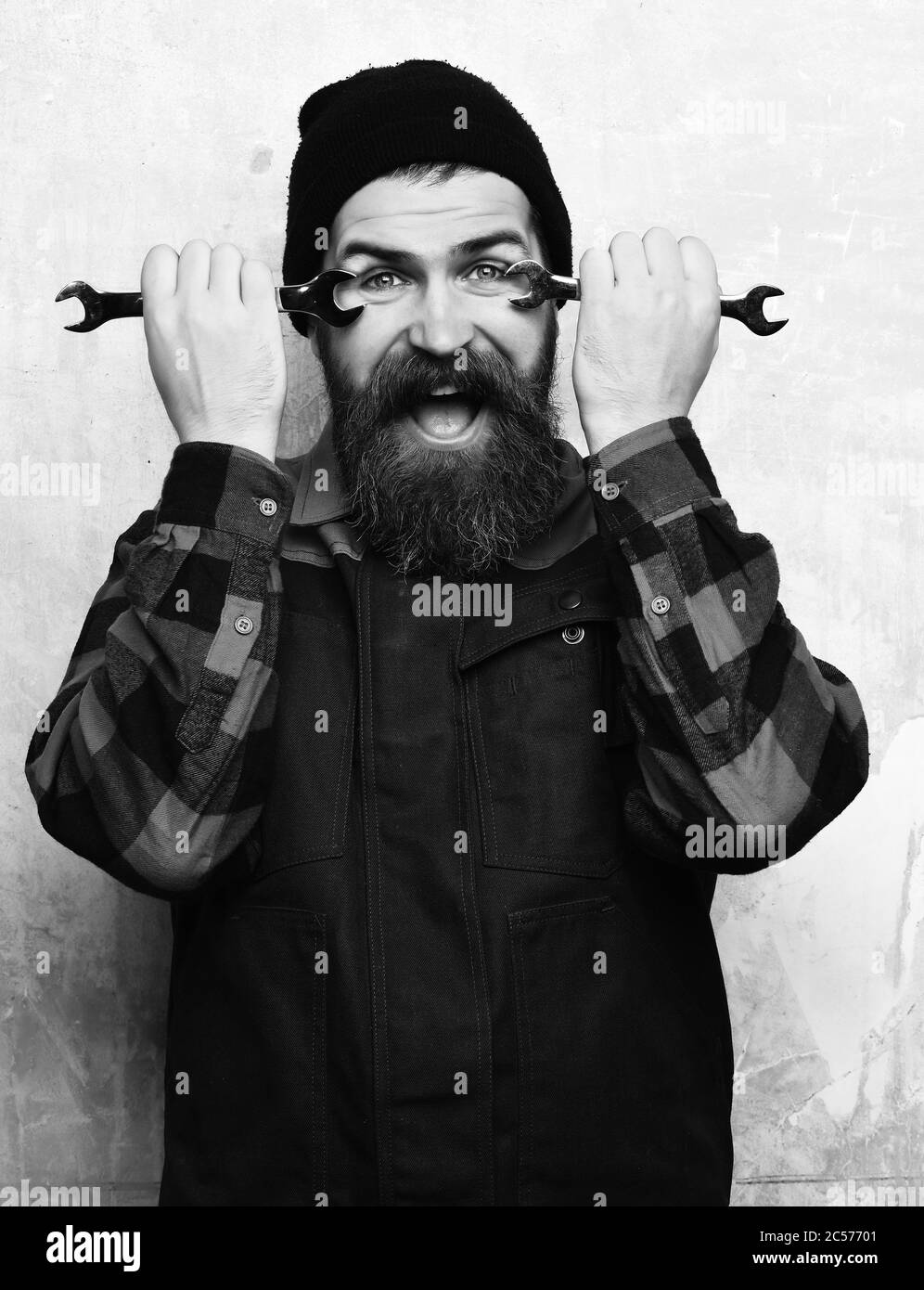 Bearded man, long beard. Brutal caucasian mechanic, smiling happy ...