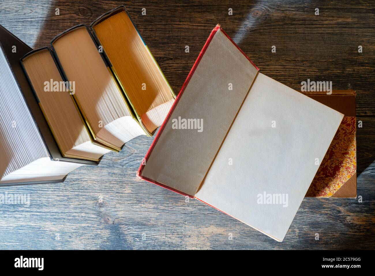 Thick paper books are a symbol of education and wisdom. A stack of ...