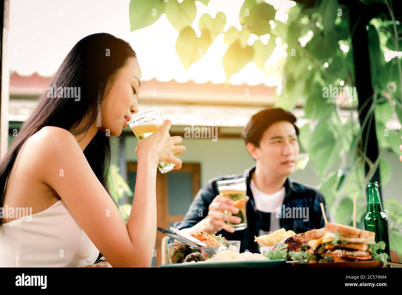 Women to toast a beer in the restaurant Stock Photo - Alamy
