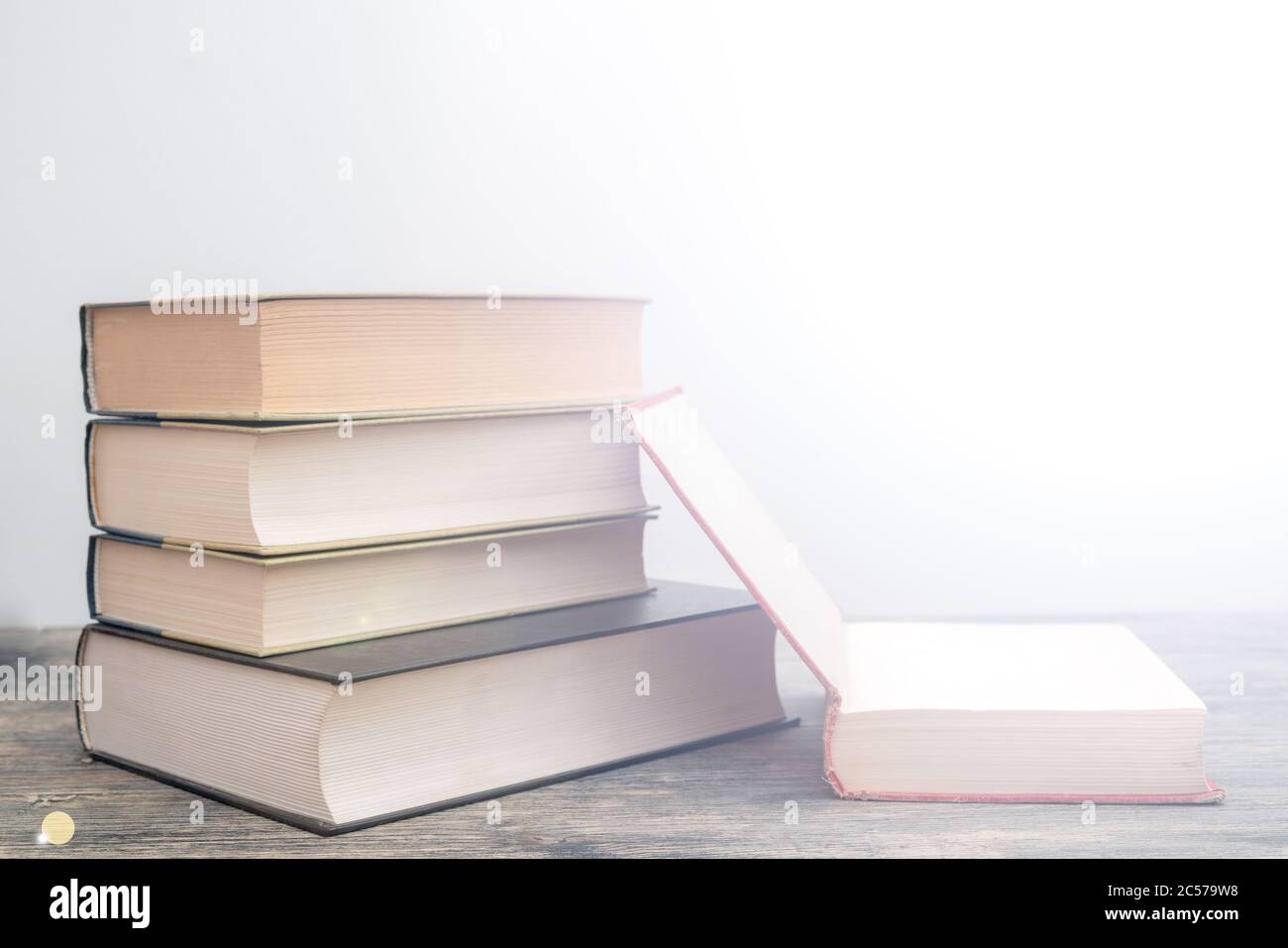 Thick paper books are a symbol of education and wisdom. A stack of ...