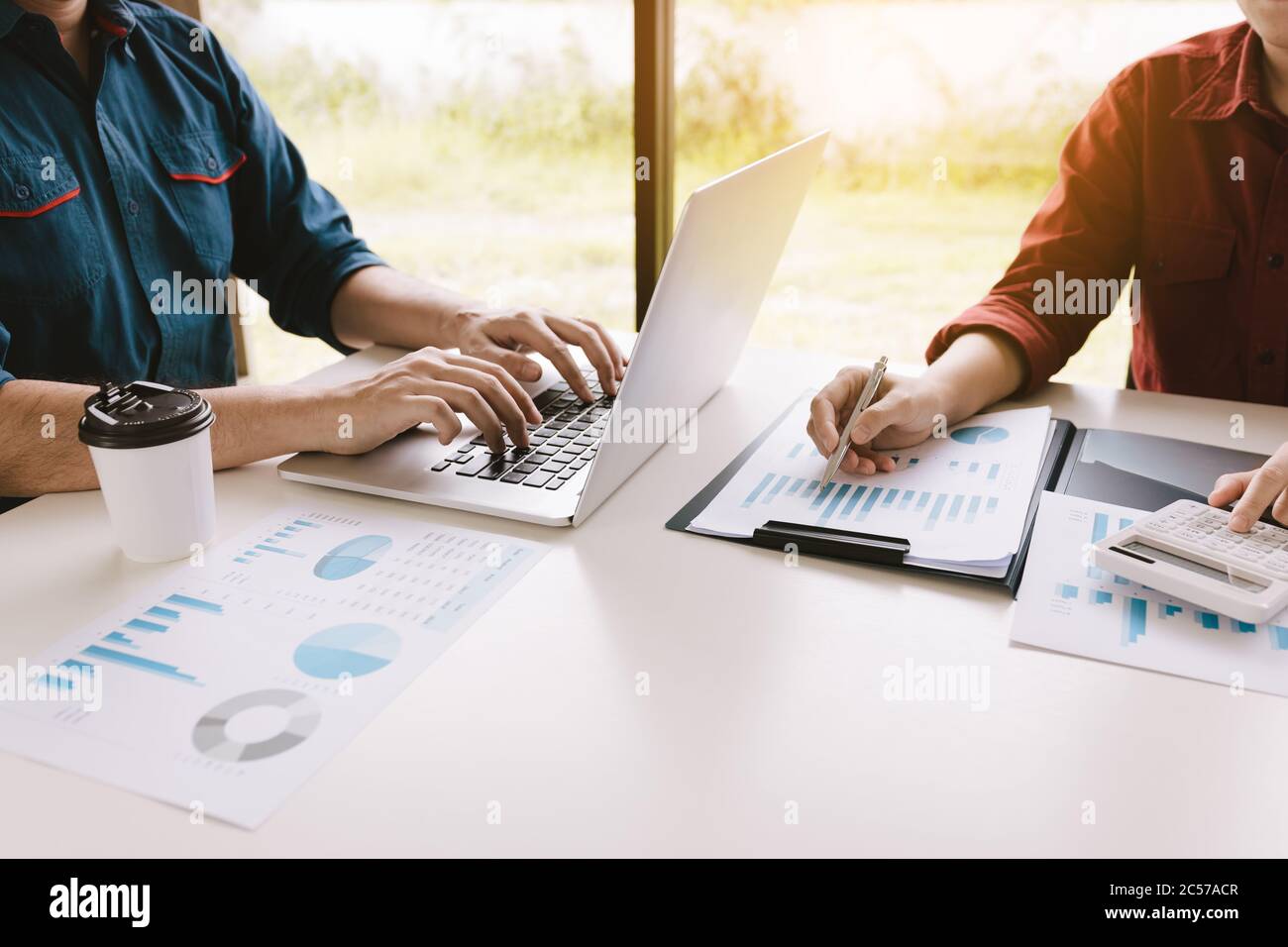 Startup people sitting together at office room table and balancing ...