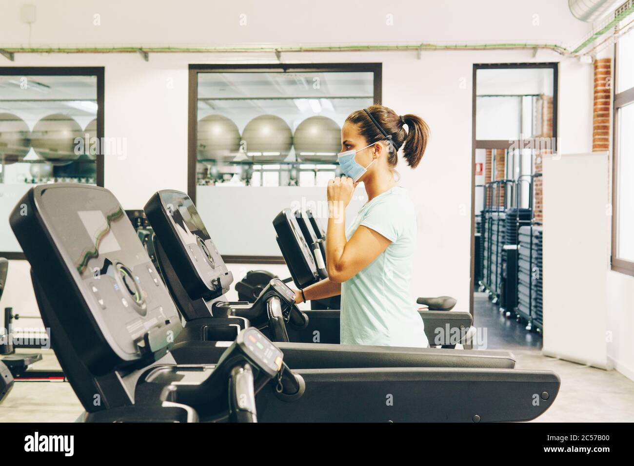 Woman treadmill mask hi-res stock photography and images - Alamy