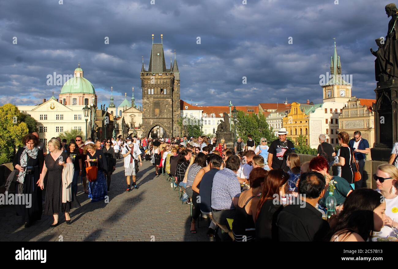 Prague citizens see coronavirus out with dinner at 500 metre long table ...