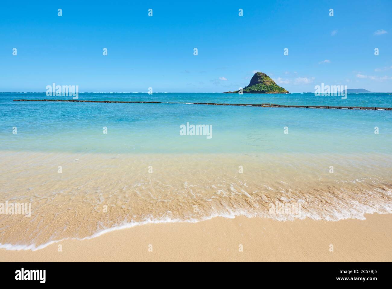Rushing waves on the sandy beach, Kualoa Rock Beach, Kualoa Point ...