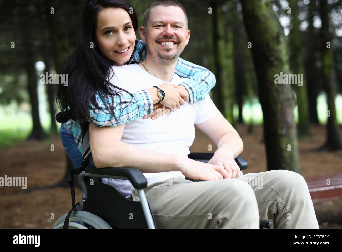 Beautiful lady hugging husband Stock Photo - Alamy