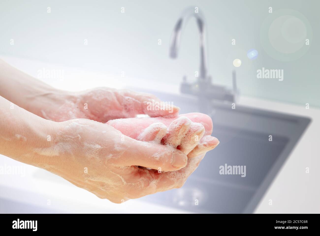Antibacterial soap in the hands. Hand disinfection with soap ...