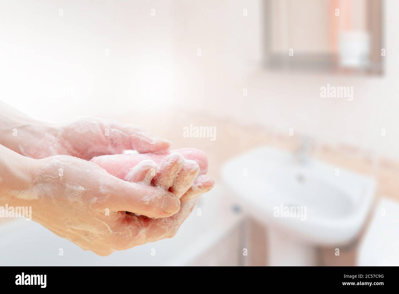 Antibacterial soap in the hands. Hand disinfection with soap ...