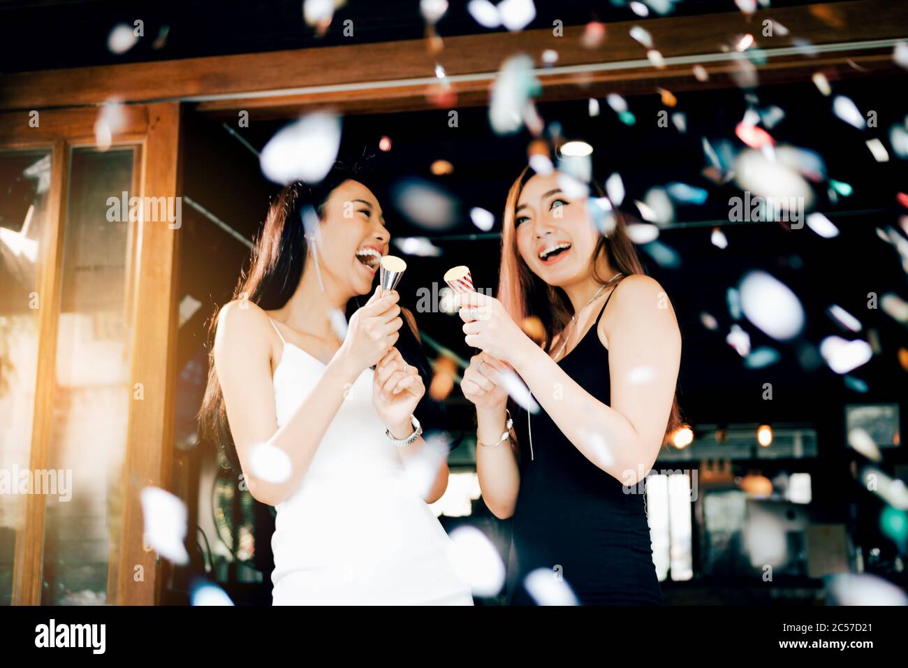 Young women celebrate home hi-res stock photography and images - Alamy
