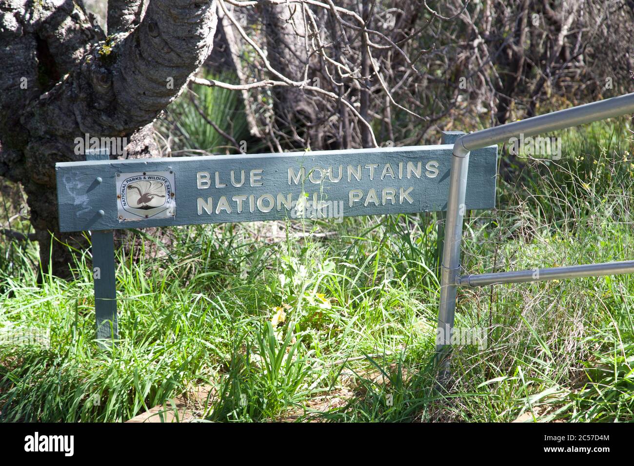 A sign indicates an entrance to the Blue Mountains National Park, close ...
