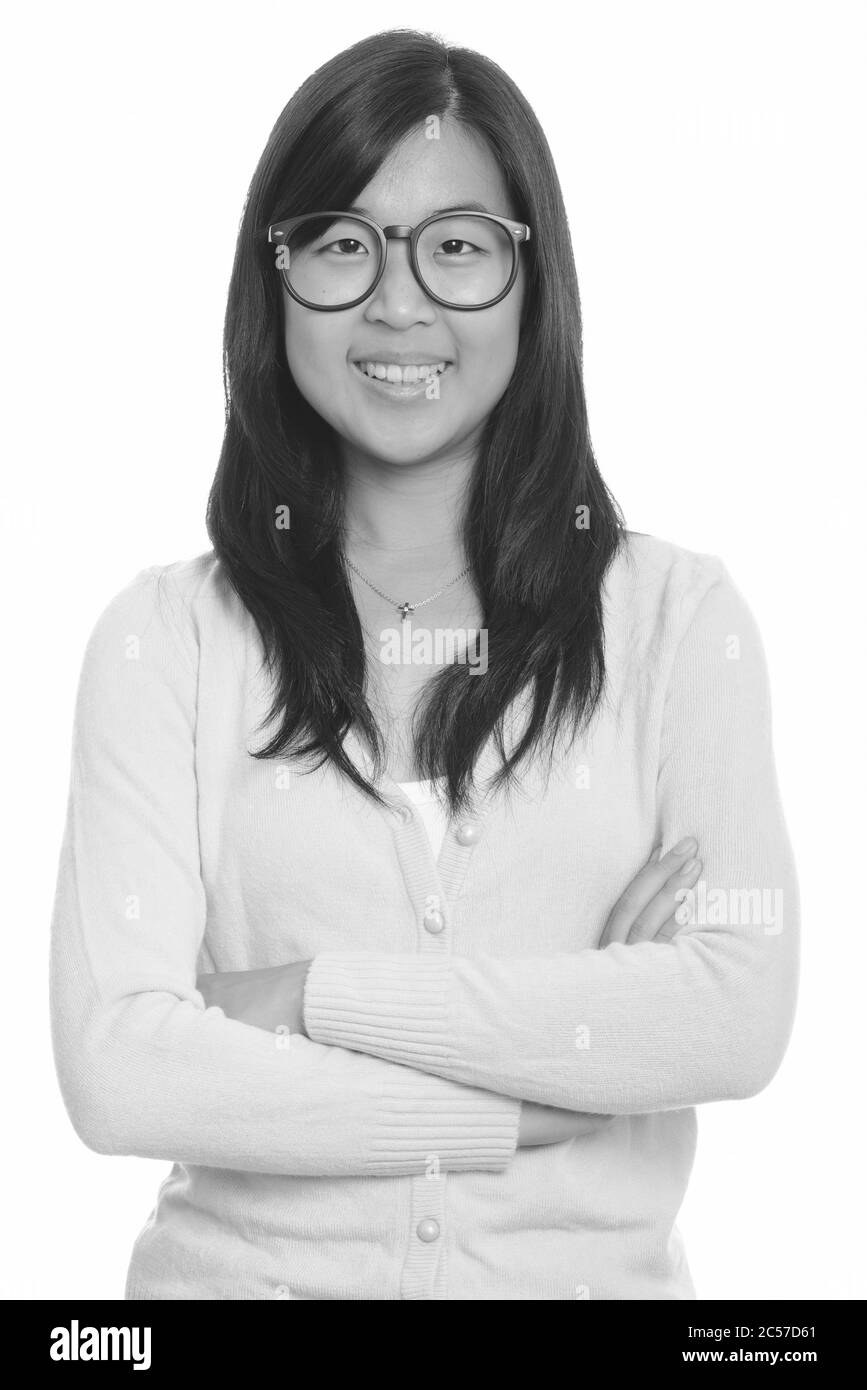 Happy young beautiful Asian nerd woman smiling with arms crossed Stock ...