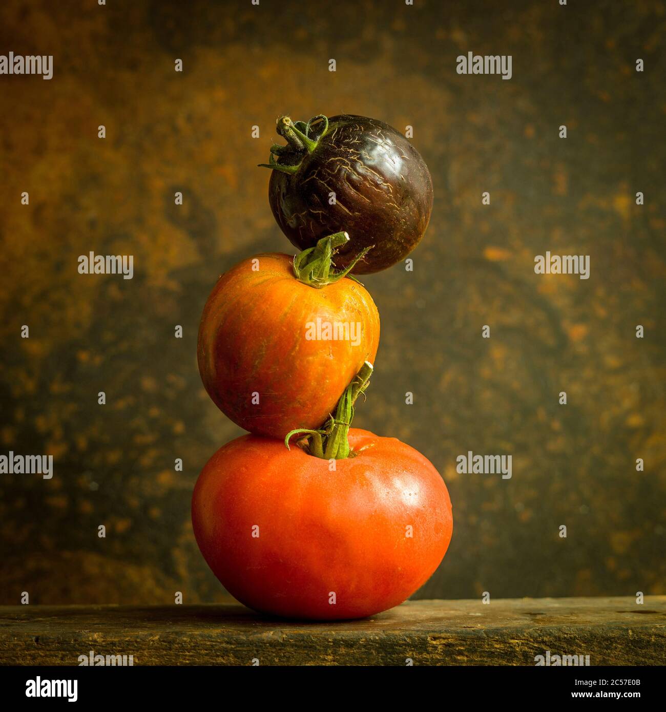 Three tomatoes of various varieties Stock Photo - Alamy