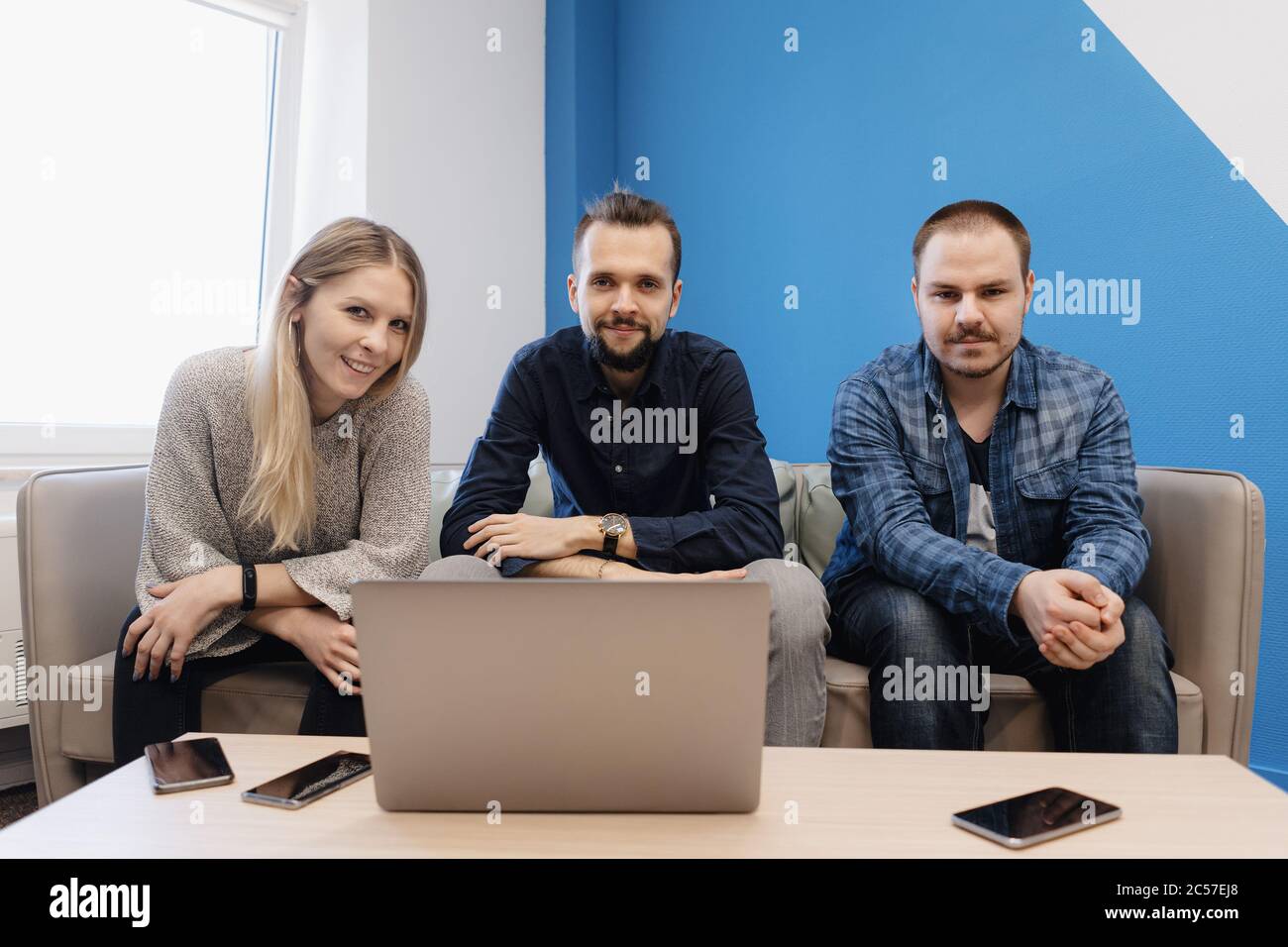 Small soft meeting area in chill out zone of office with three persons ...