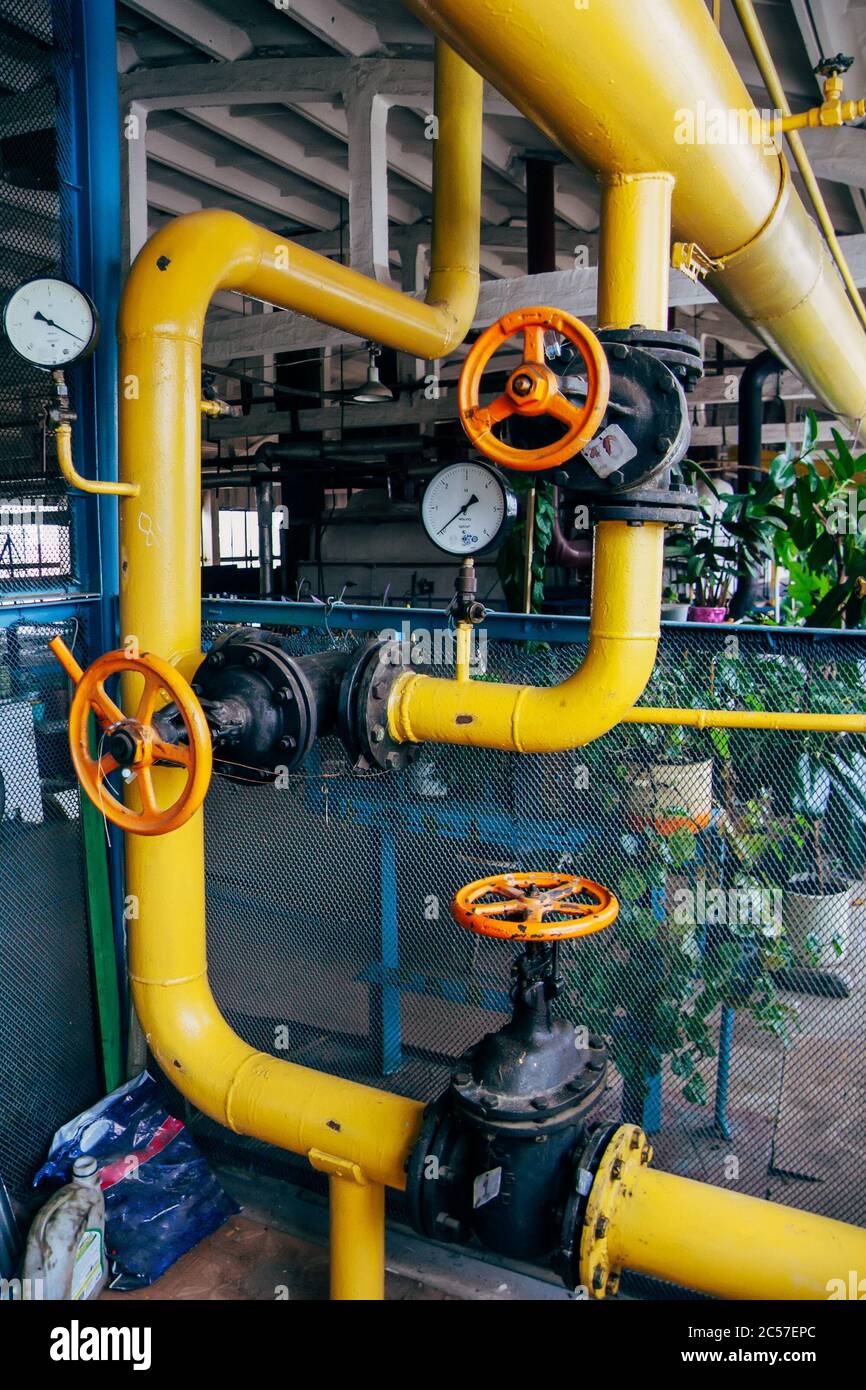 Steel industrial pipeline with valves and manometers in boiler room ...
