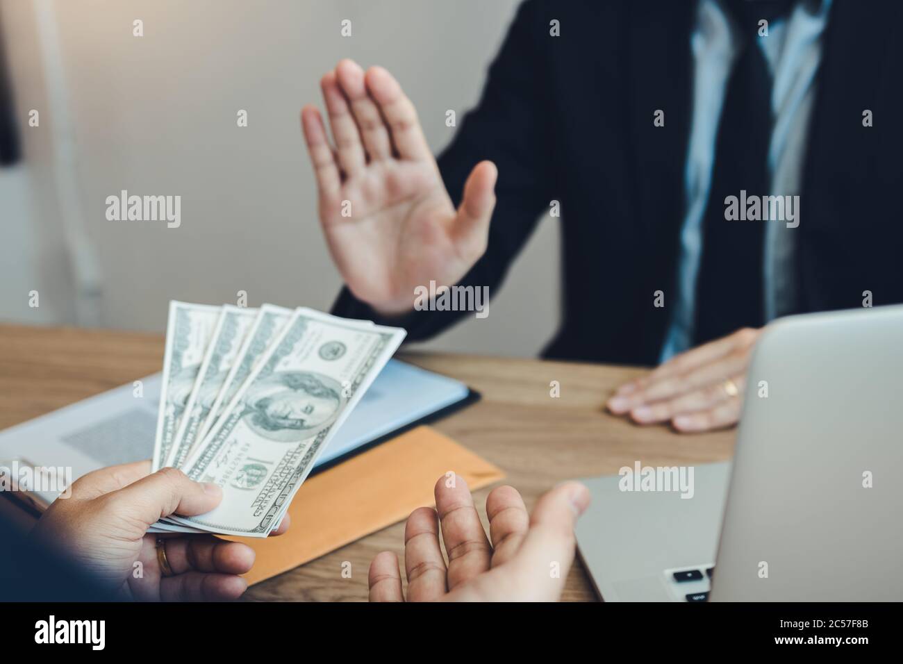 Businessperson refusing bribe given money by partner with anti bribery ...