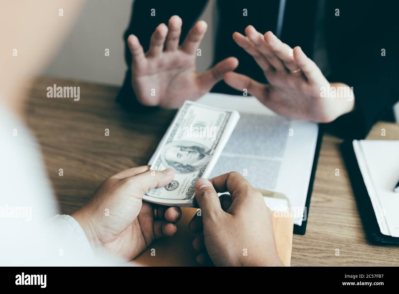 Businessperson refusing bribe given money by partner with anti bribery ...