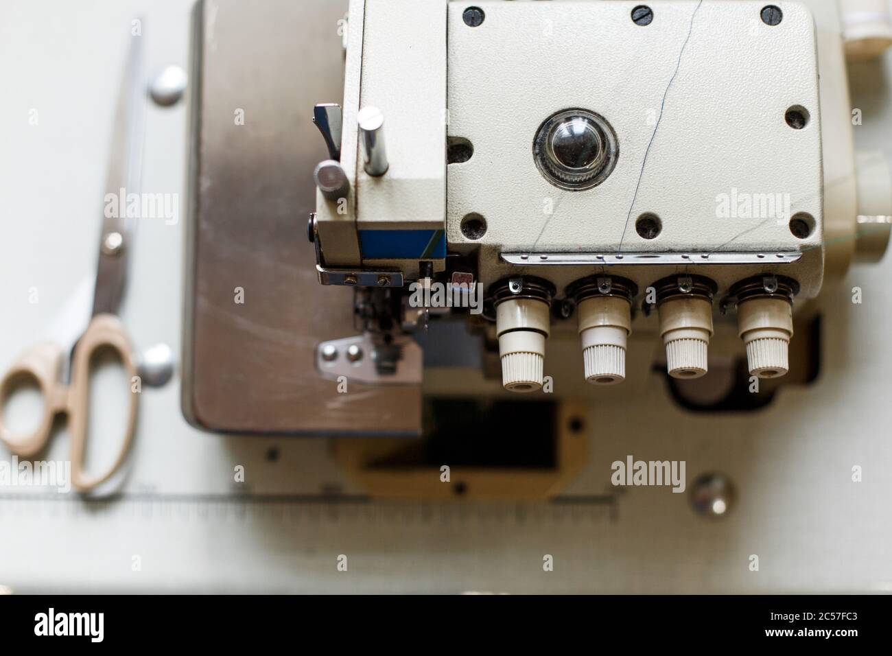 top view closeup details on sewing machine overlock. Workplace ...
