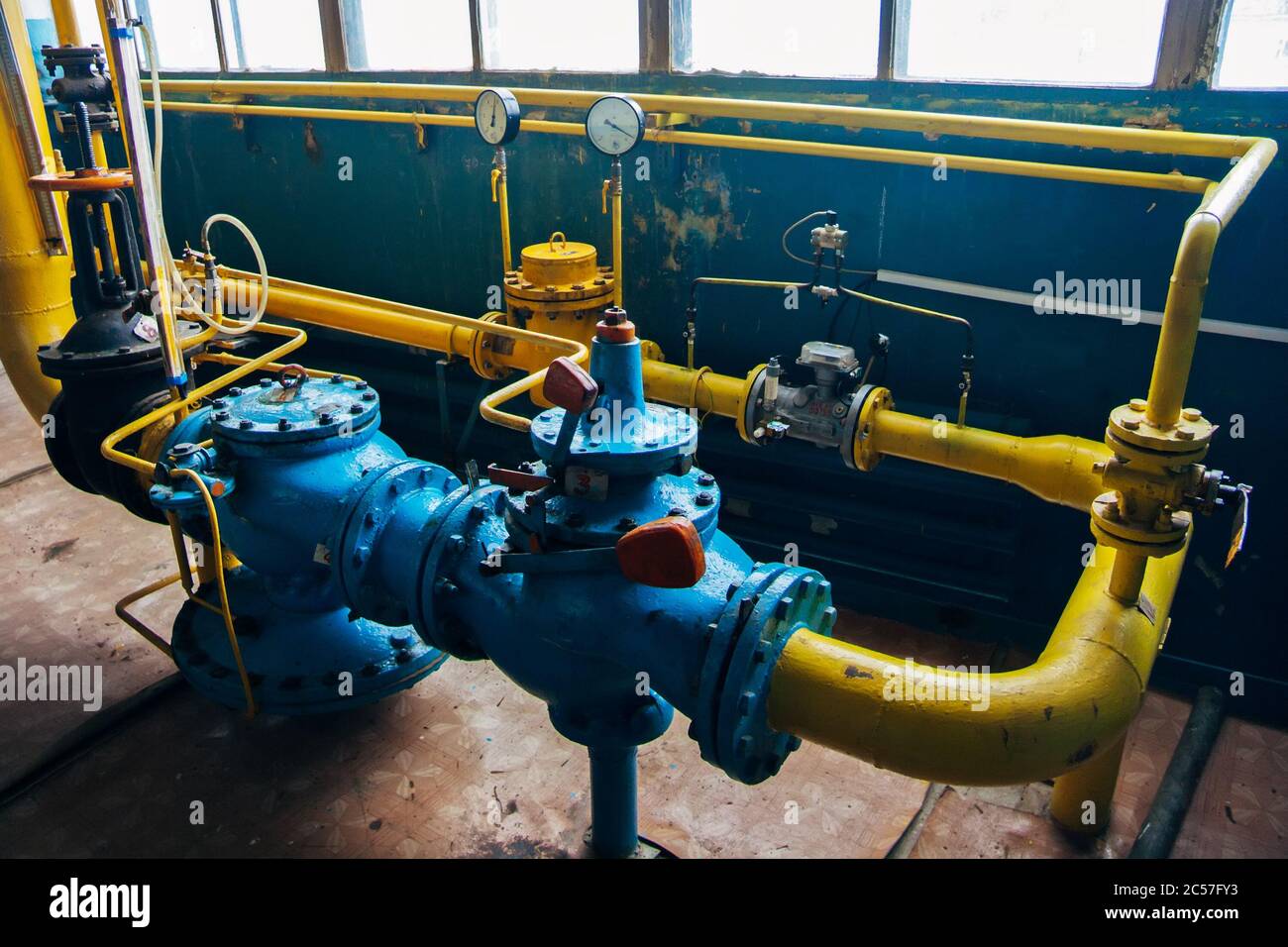 Steel industrial pipeline with valves and manometers in boiler room ...