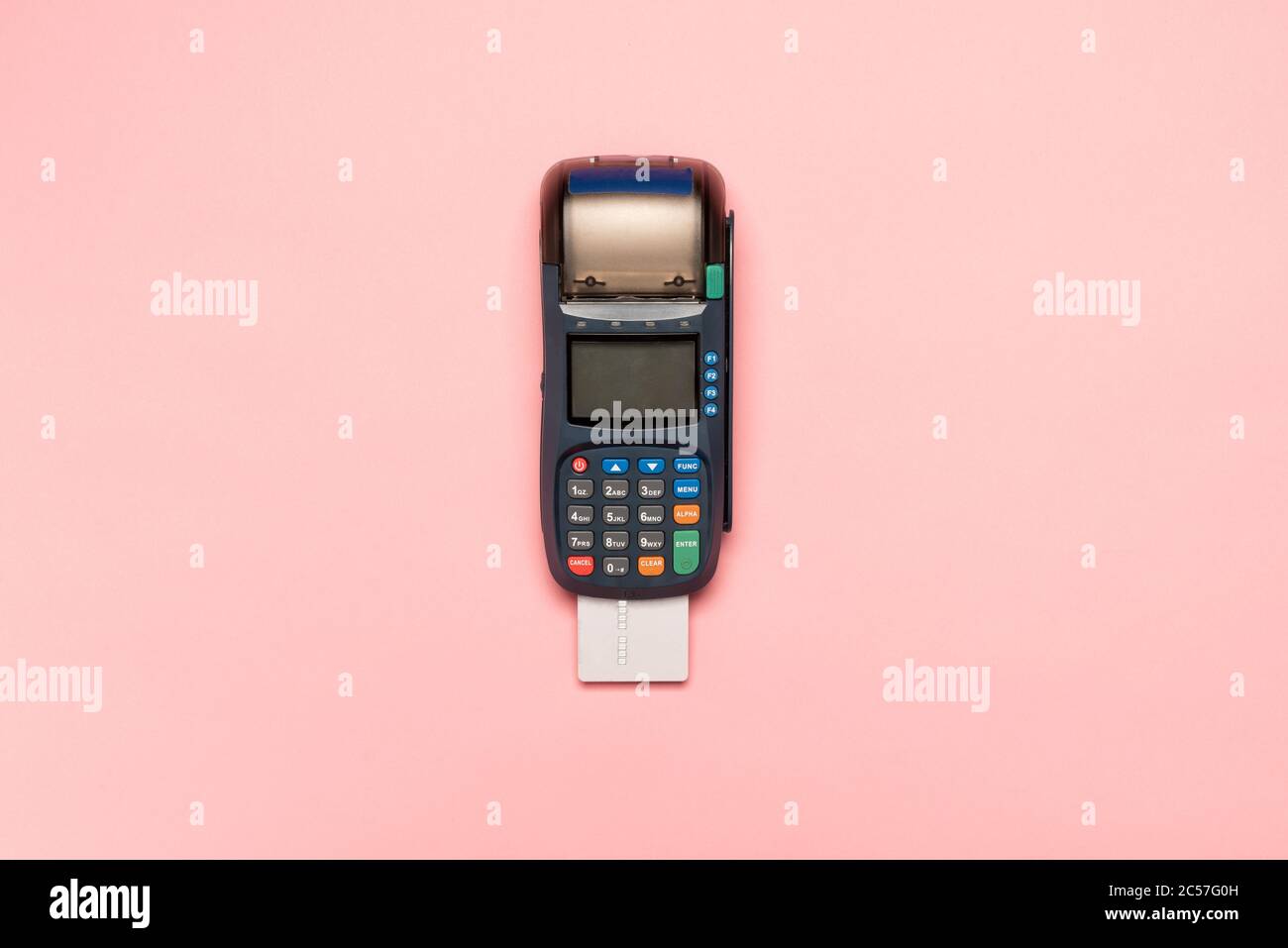 NFC payment contactless terminal on a pink background. Credit card or ...