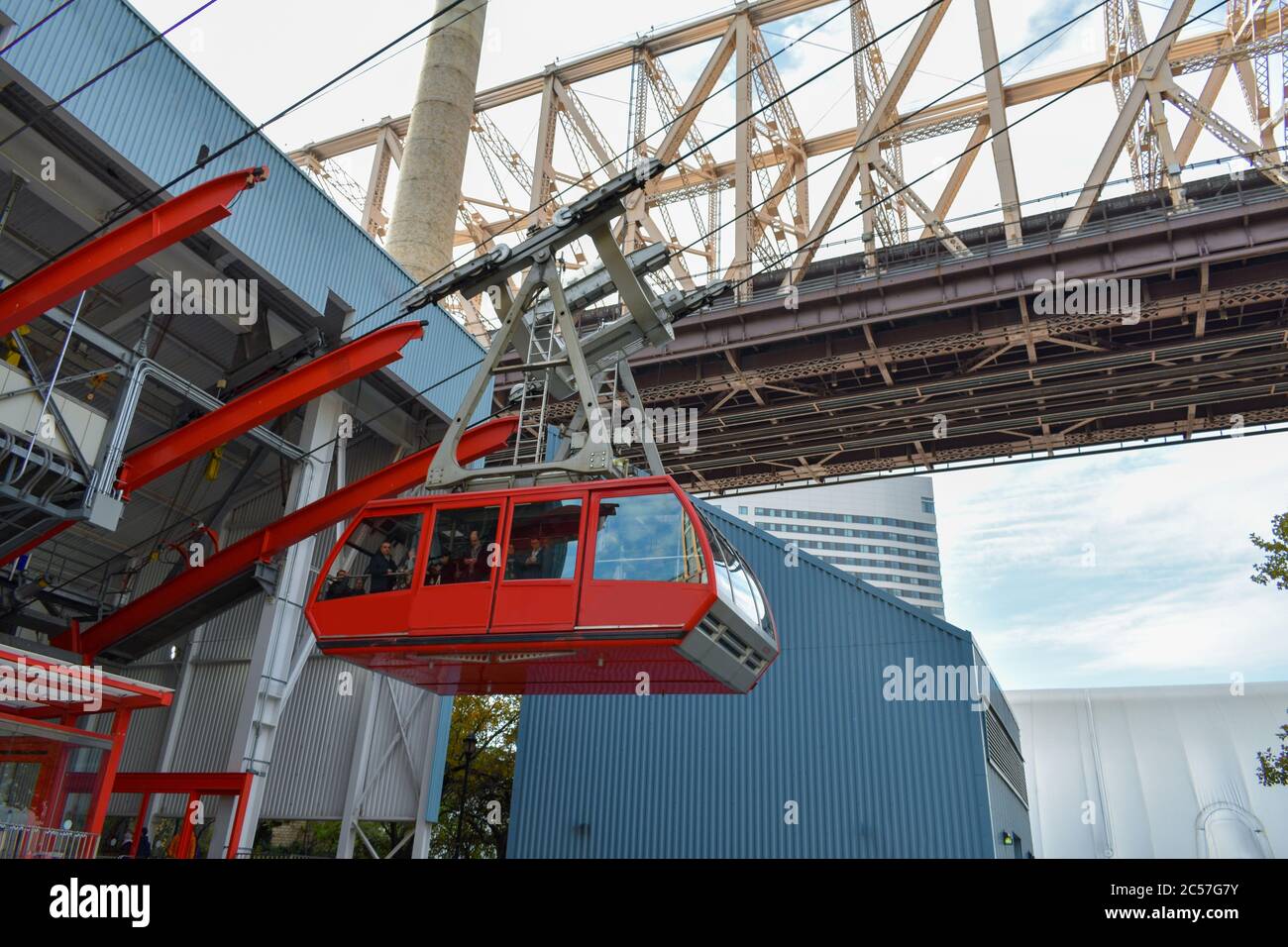 Ropeway with a red cabin during daytime Stock Photo - Alamy