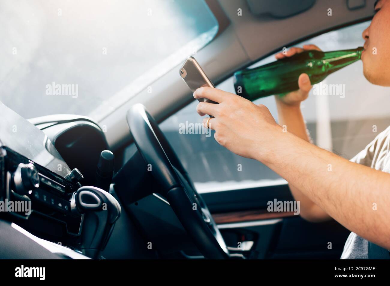 People using their phones while driving hi-res stock photography and ...