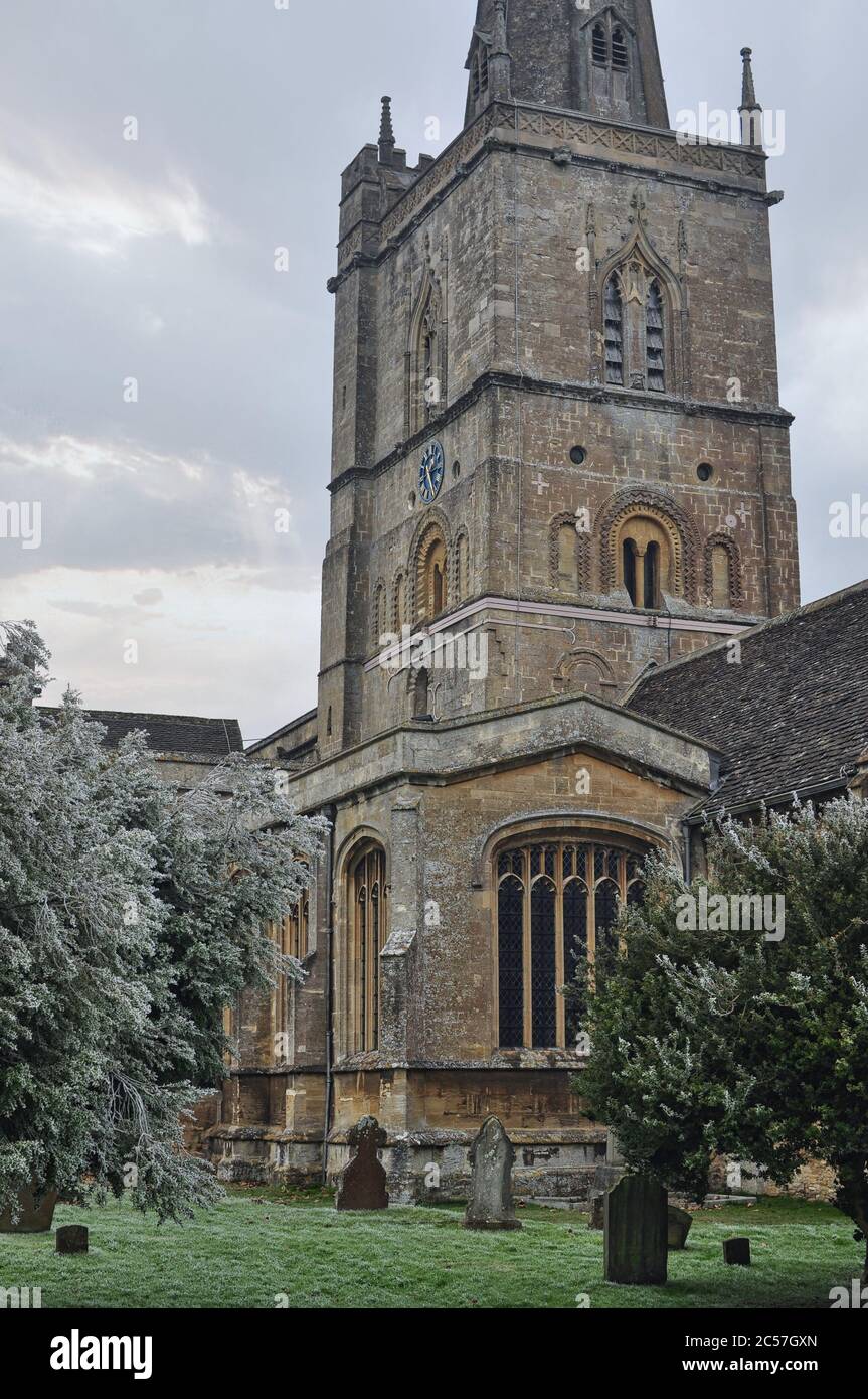 Burford Church and graveyard in Oxfordshire on a frosty winter's ...