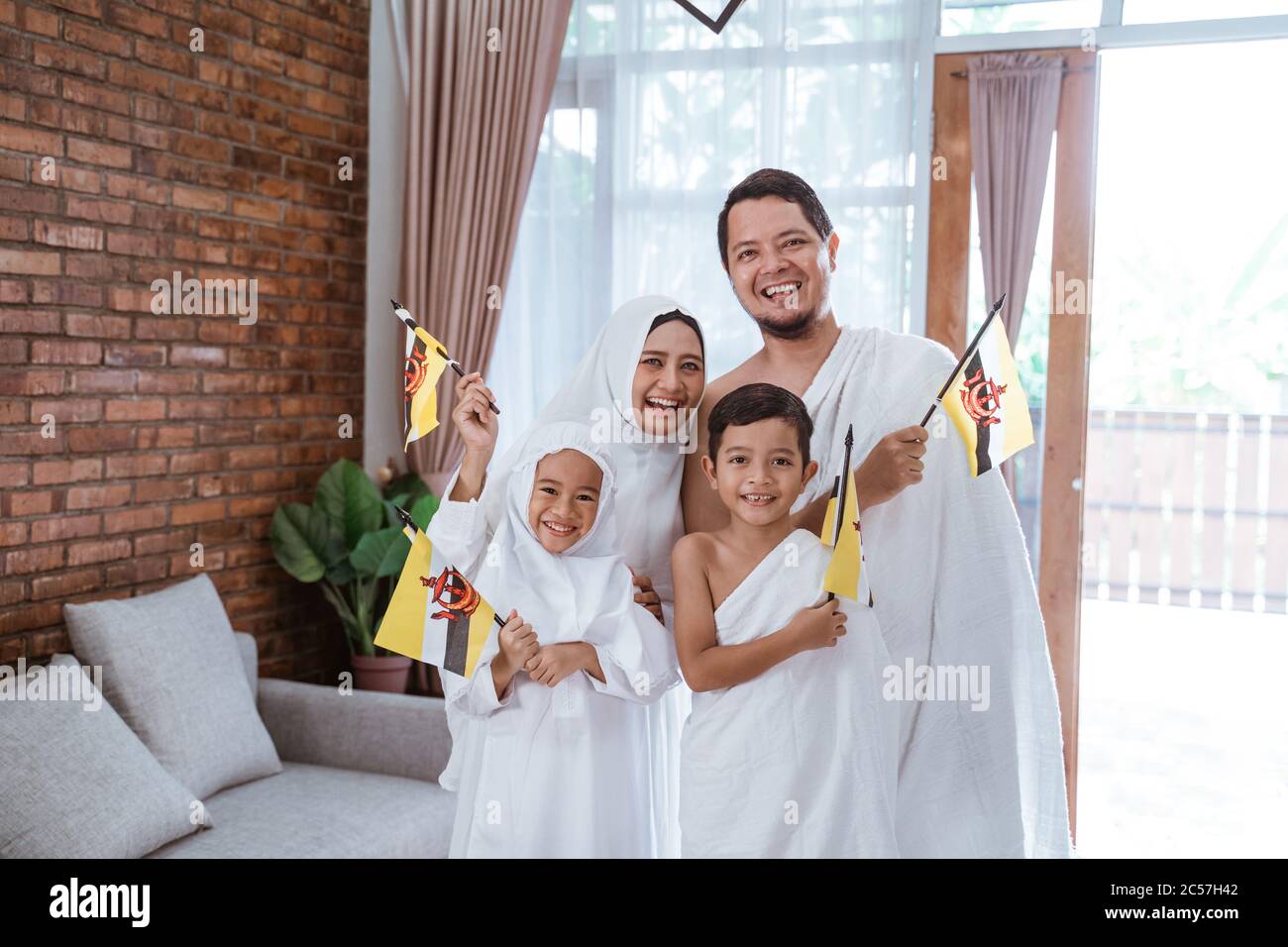 muslim umrah and hajj with family holding brunei flag Stock Photo - Alamy