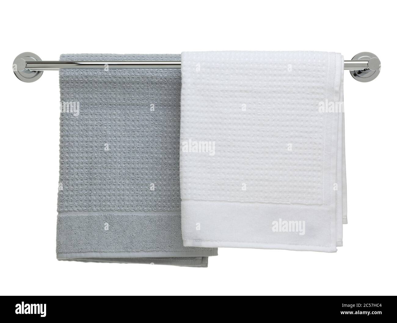 two terry cloth towels on a chrome plated towel rail isolated on white ...