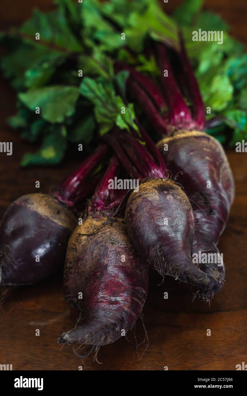 Vertical photo of a bunch of red turnips on a wooden surface Stock ...