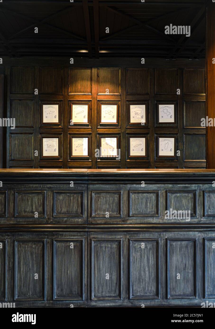 Vertical shot of a wooden reception desk in the hotel Stock Photo - Alamy