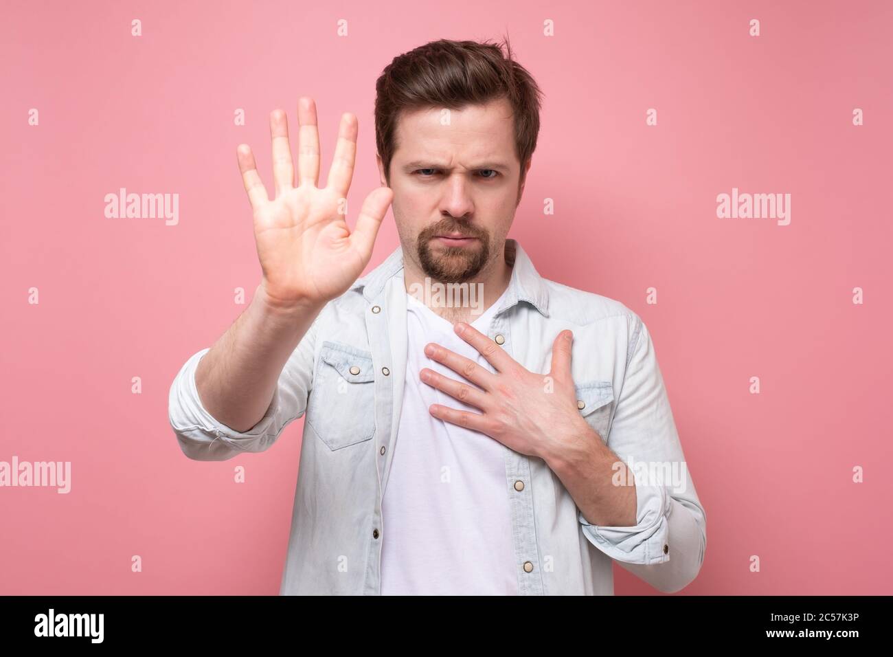 man holding out his hand to show stop gesture Stock Photo - Alamy