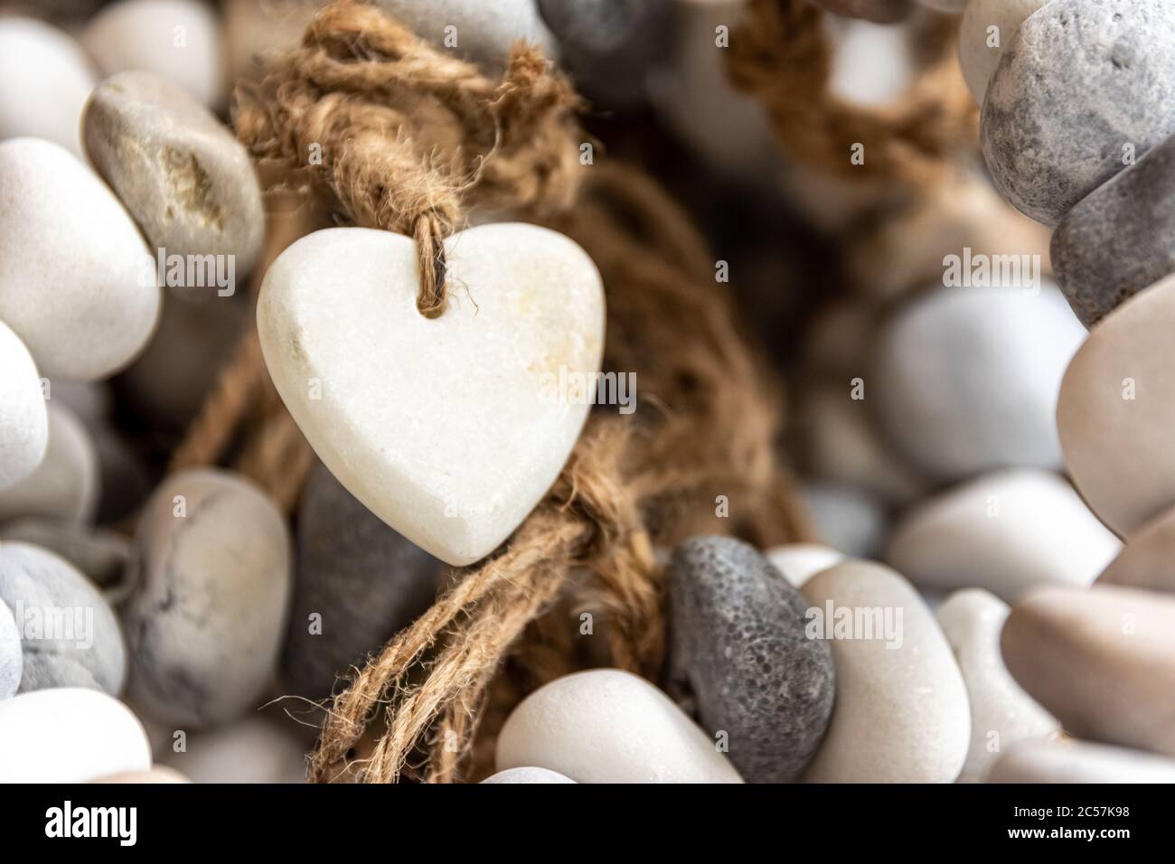 White stone shaped like heart hi-res stock photography and images - Alamy